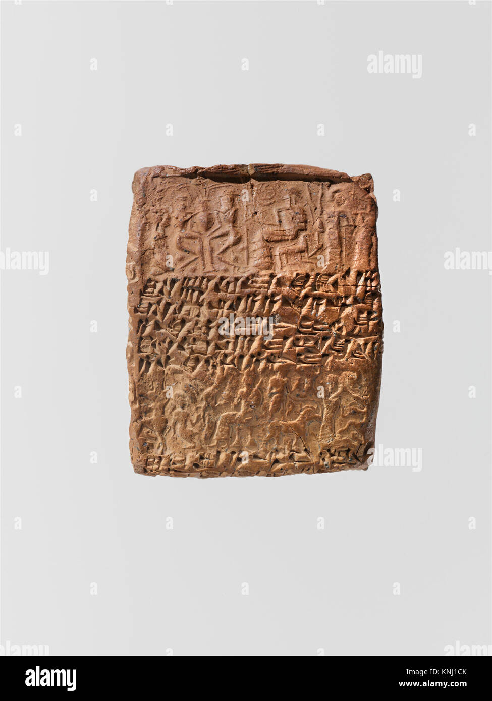 A cuneiform tablet case made of clay, impressed with four distinct ...