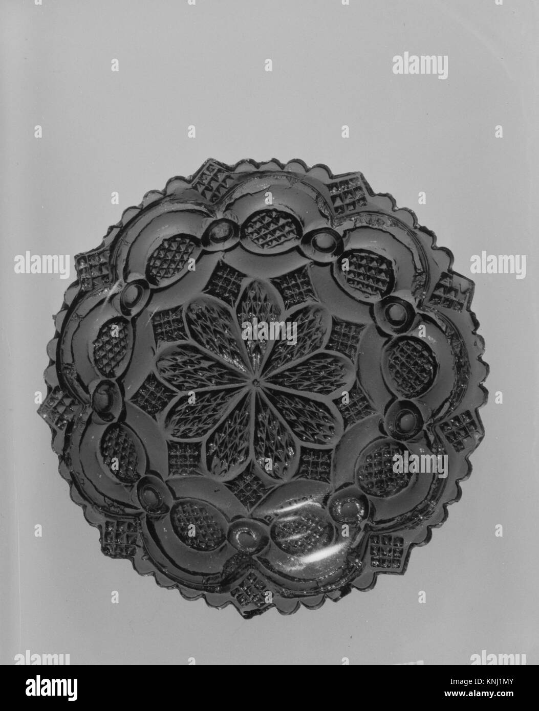Ceramic dish featuring detailed decorative motifs and traditional ...