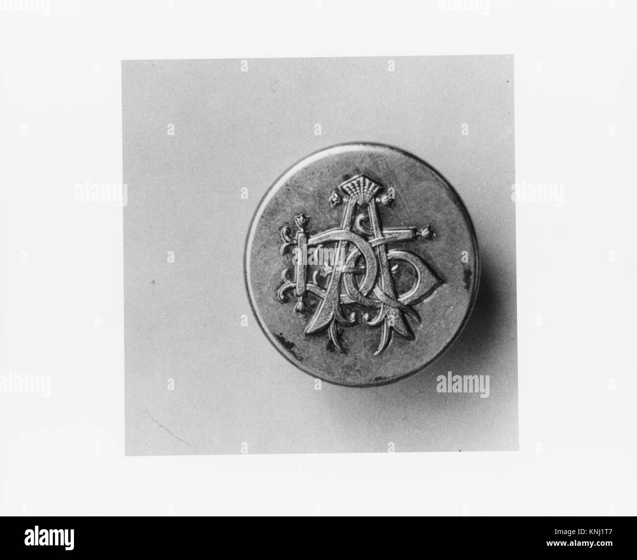 This silver-plated button, created by the Waterbury Button Company ...