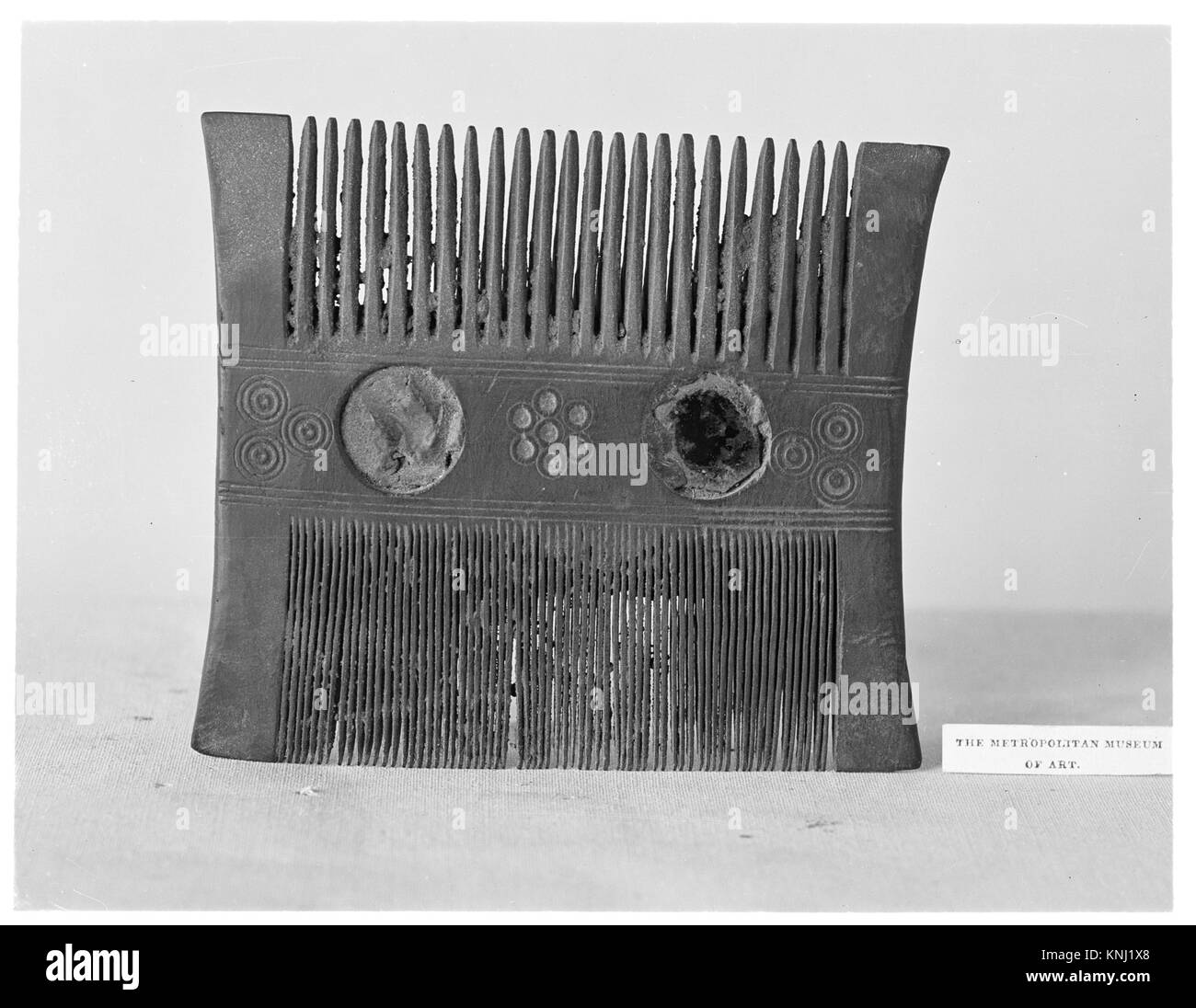 This comb, made of fine materials, showcases intricate design and ...