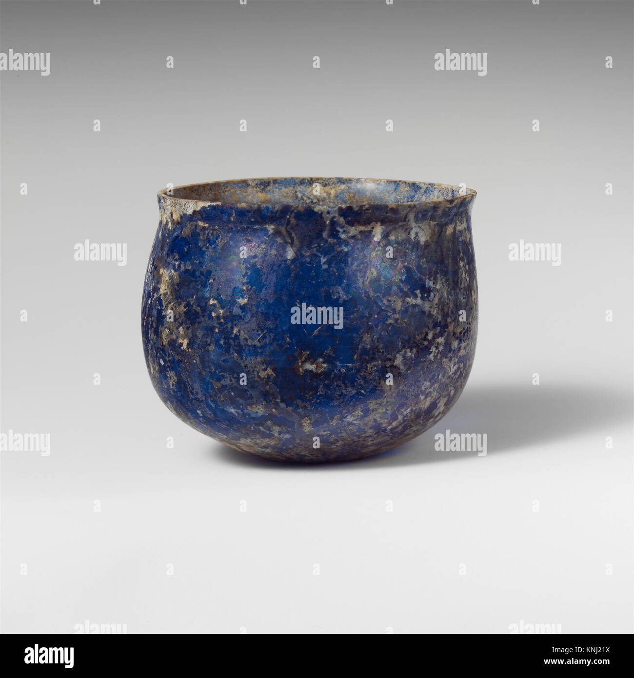 This delicate glass cup features intricate design and craftsmanship ...