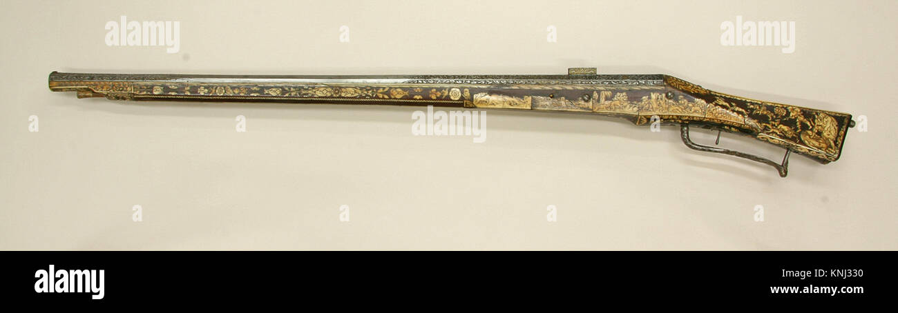 This firearm features both a wheellock and matchlock mechanism ...