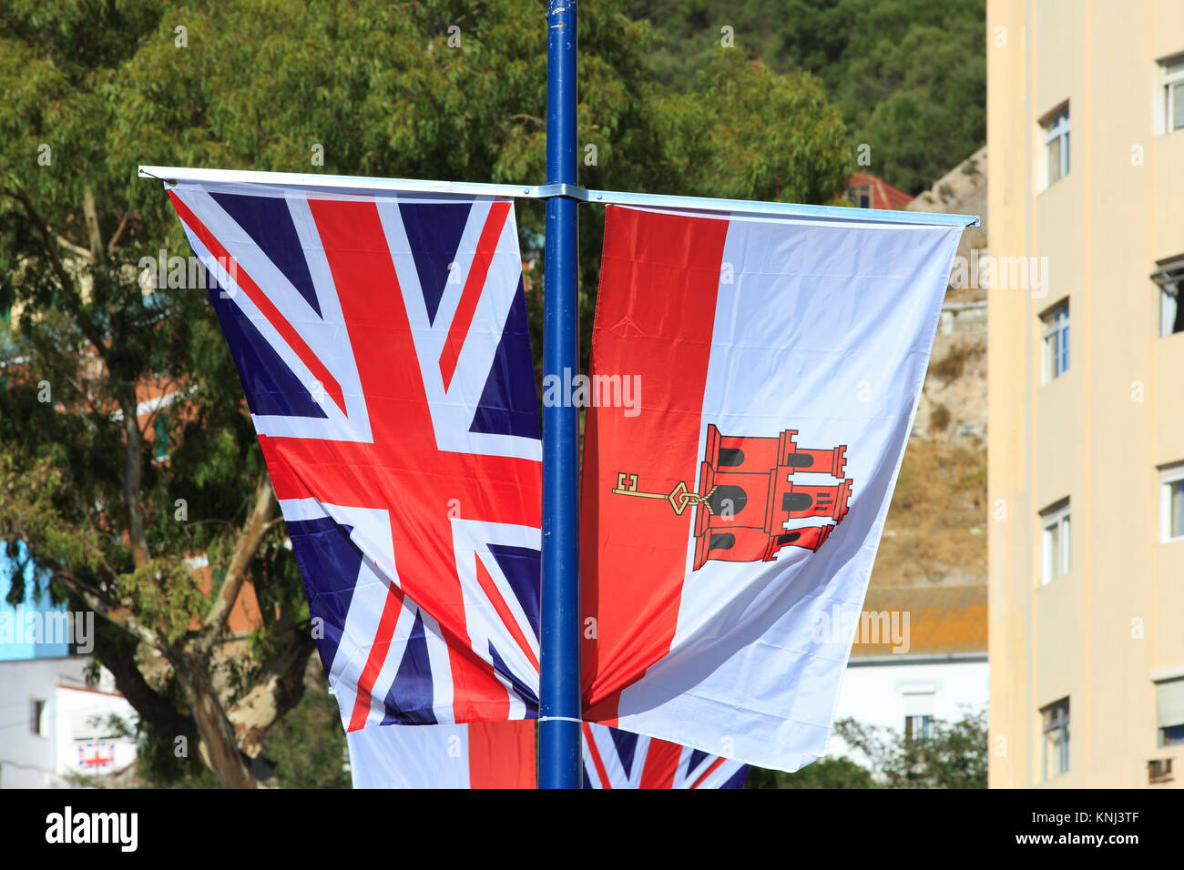 The flags of Great Britain and Gibraltar side by side in the old town ...