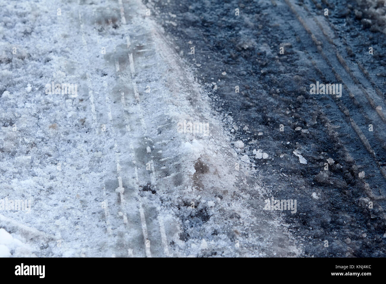 tyre tracks in compacted snow showing black ice underneath newtownabbey ...