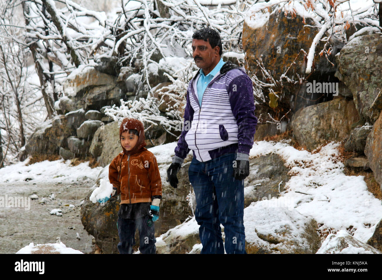 Anantnag, India. 11th Dec, 2017. Indian Tourist enjoying snowfall at pahalgam. Credit: Muneeb Ul ...