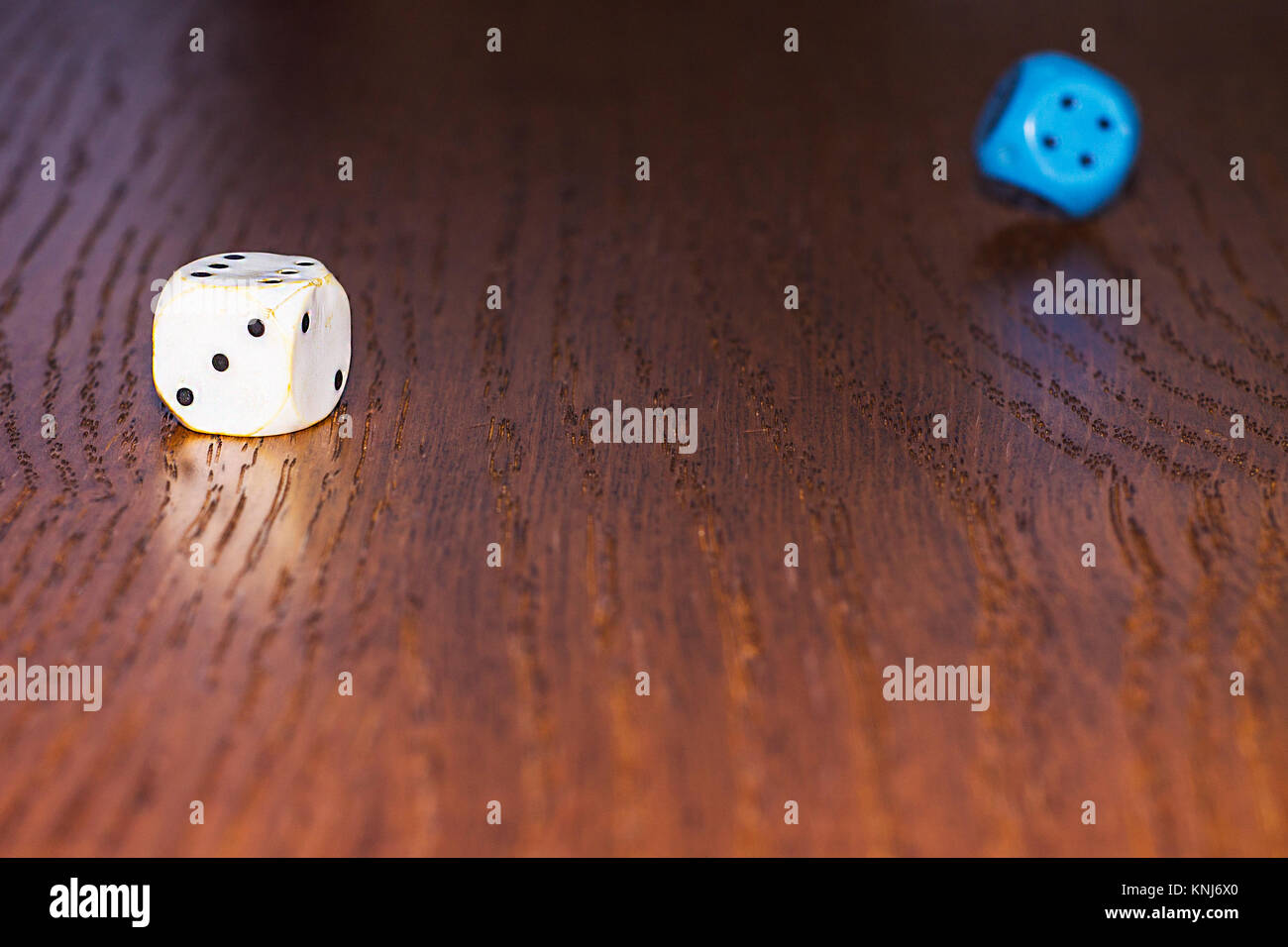 The dice roll on the wooden table. Role-playing game Dungeons and ...