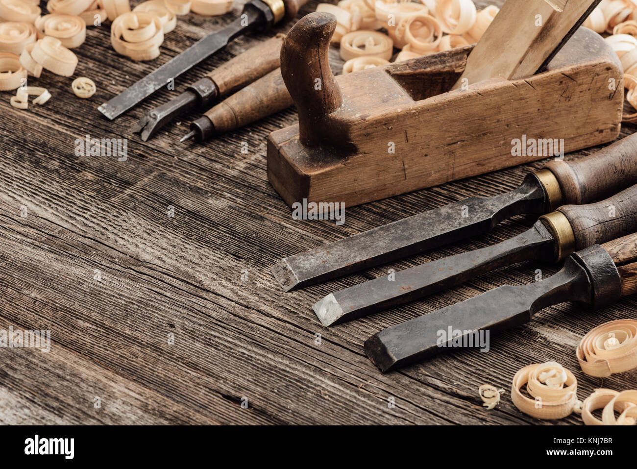 Old carving and woodworking tools and wood shavings on a vintage ...