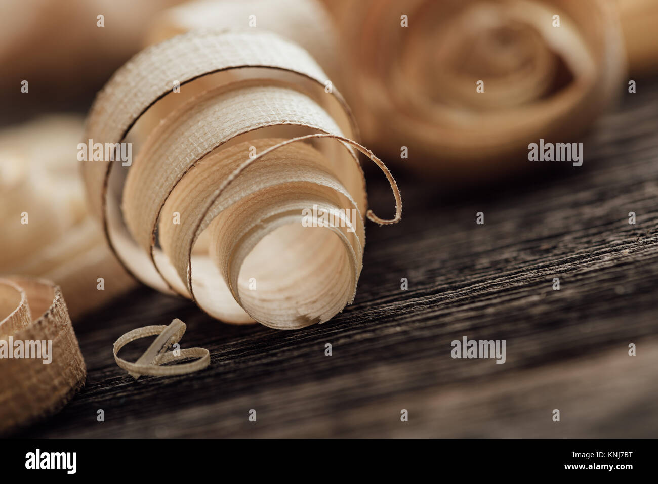 Wood shavings on the carpenter's workbench close up: woodworking and ...