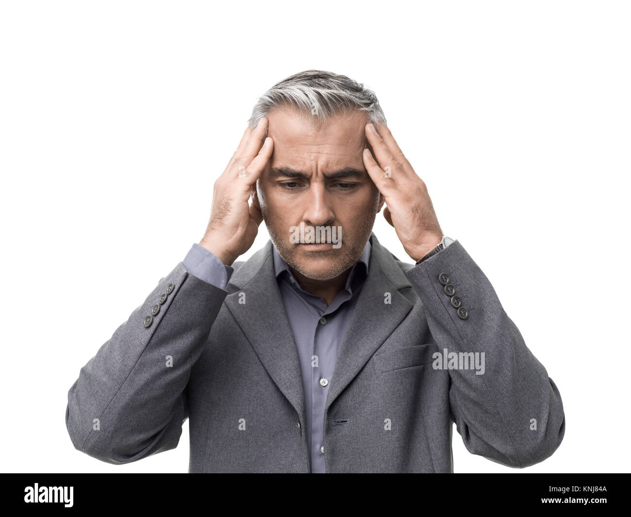 Stressed overworked businessman with head in hands, he is having a bad ...
