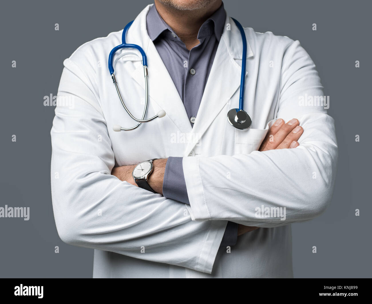 Confident doctor posing with arms crossed, medical advice and health ...