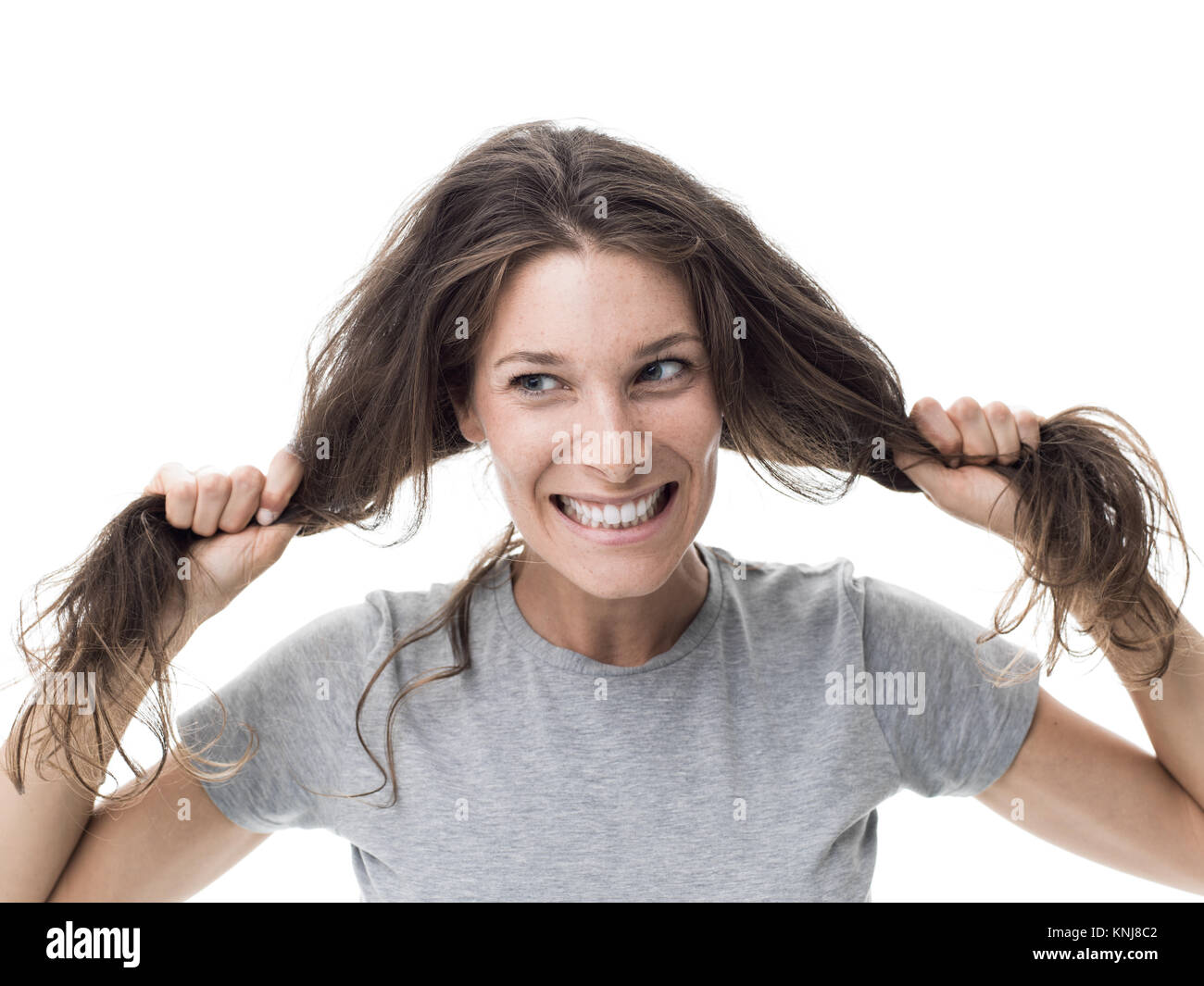 Angry Woman Having A Bad Hair Day She Is Pulling Her Messy And Tangled