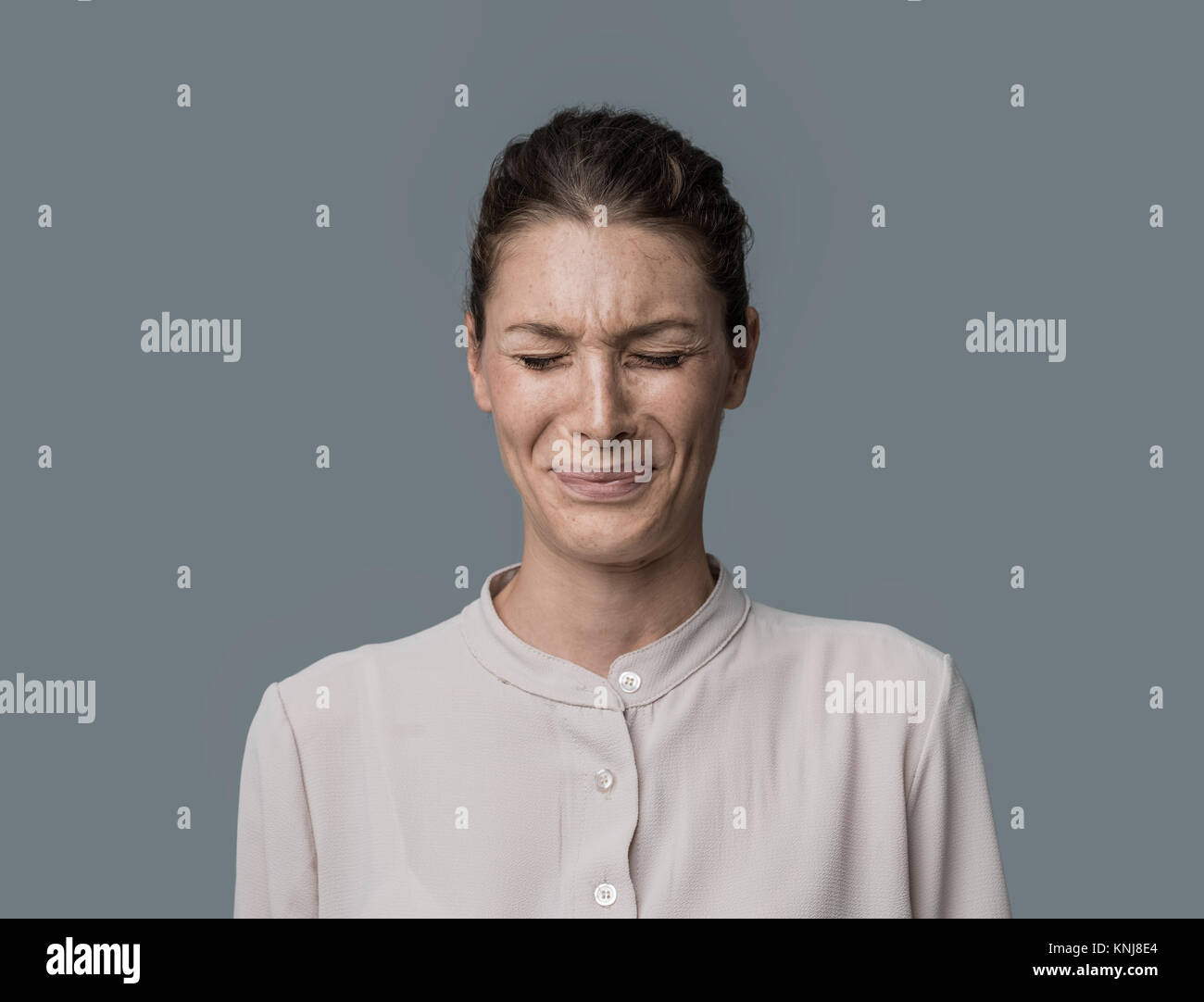 Disgusted disappointed woman frowning and looking at camera Stock Photo ...