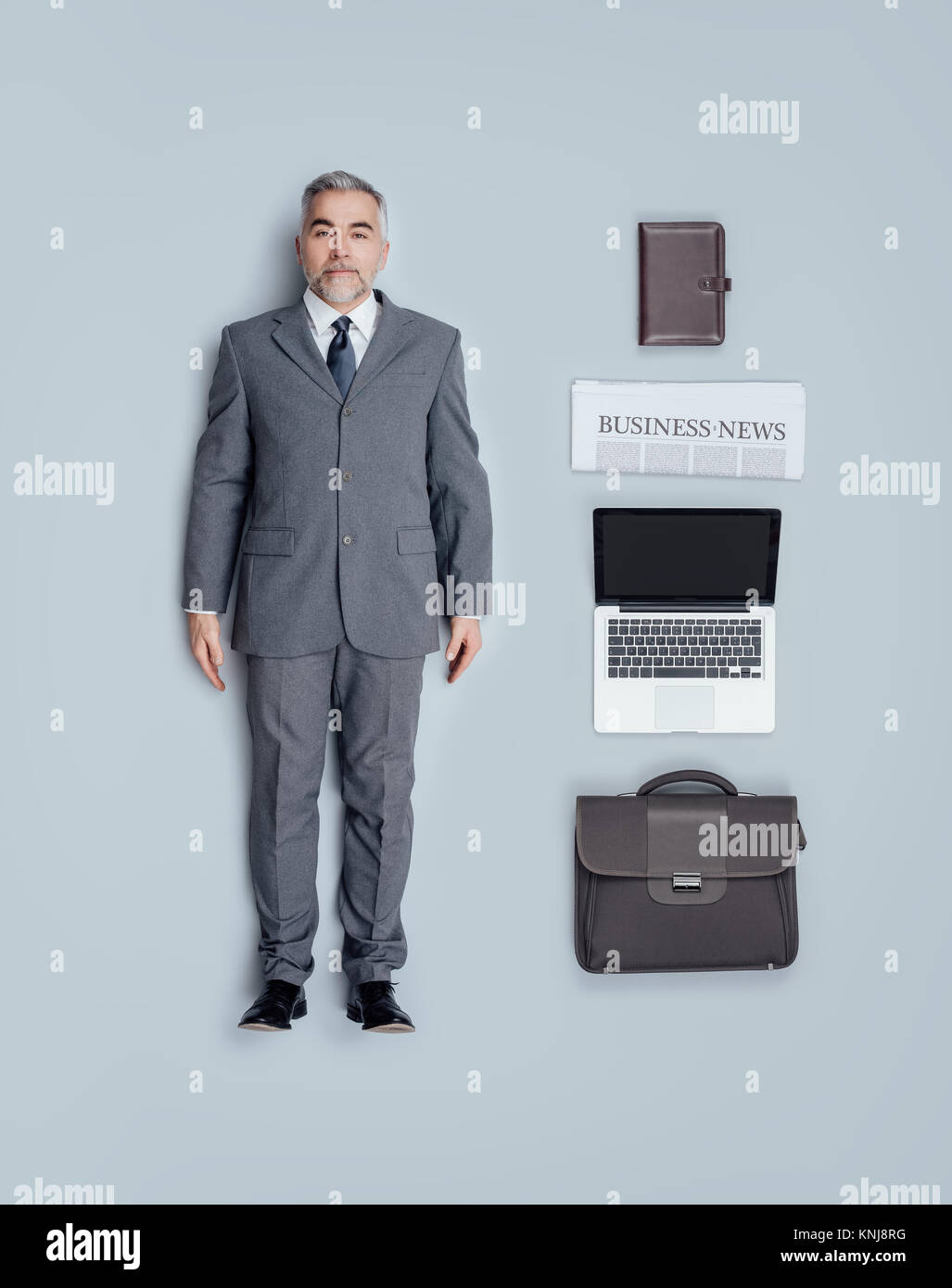 Realistic corporate business executive doll with work tools, flat lay ...