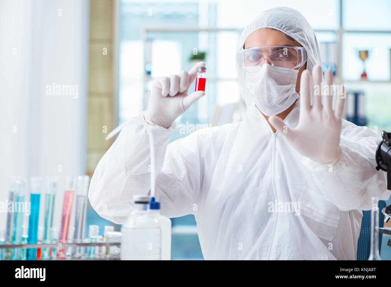 Chemist working in the laboratory with hazardous chemicals Stock Photo ...