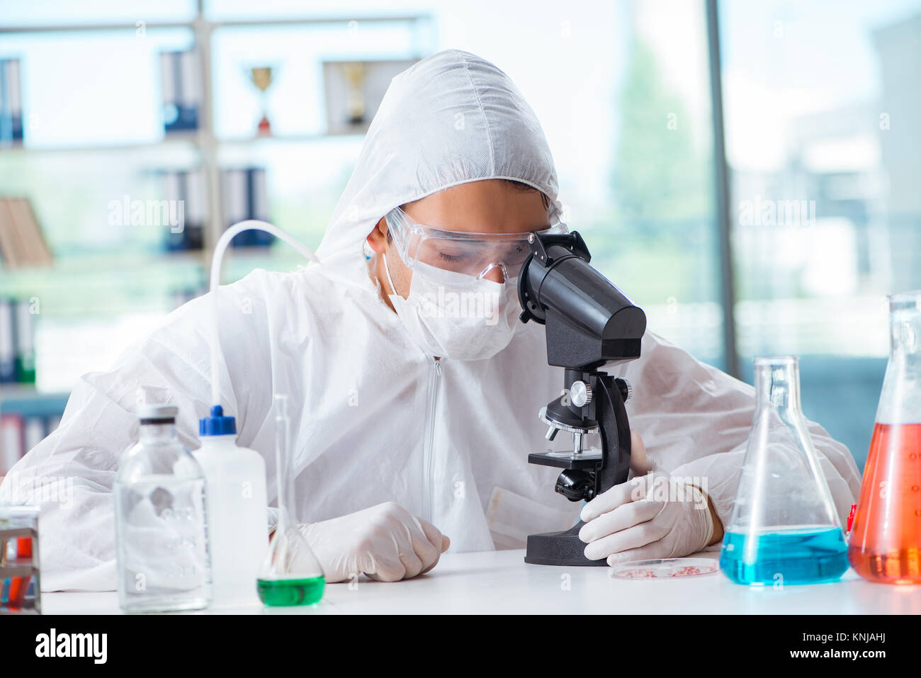 Chemist working in the laboratory with hazardous chemicals Stock Photo ...