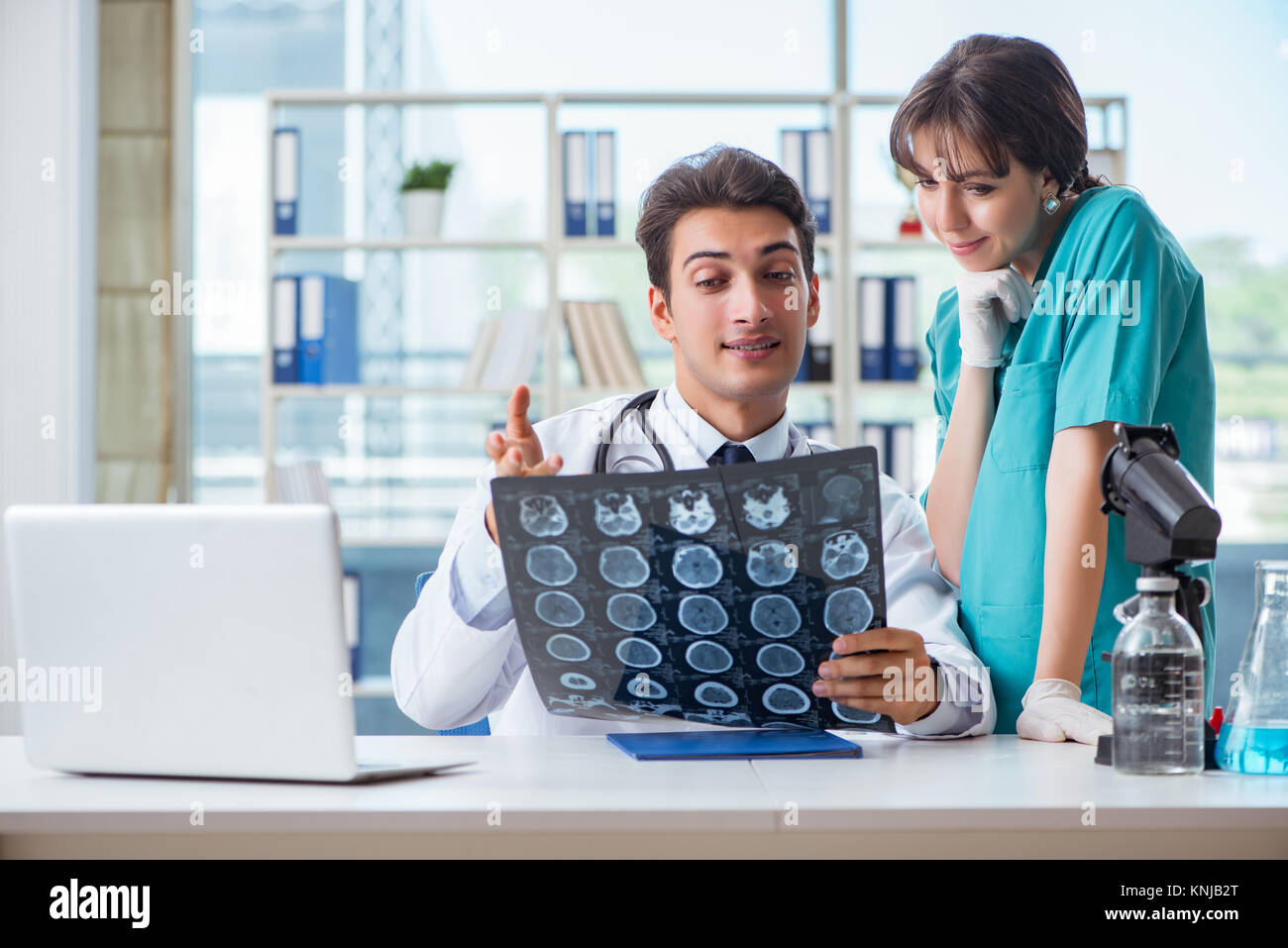Two doctors discussing patient mri hi-res stock photography and images ...