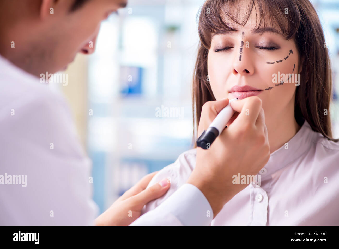 Plastic surgeon preparing for operation on woman face Stock Photo - Alamy