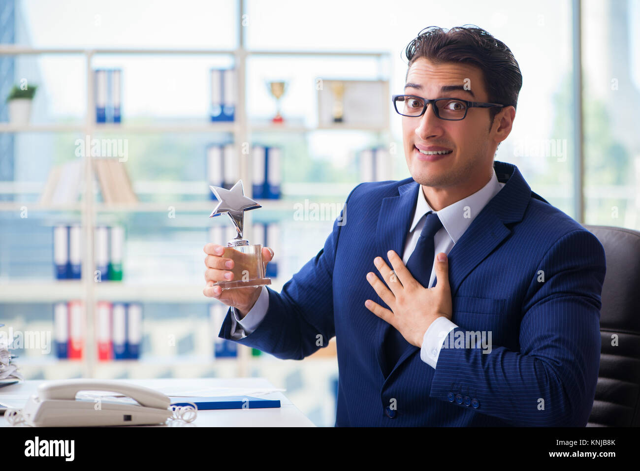 Businessman winning best employee of the month award Stock Photo - Alamy