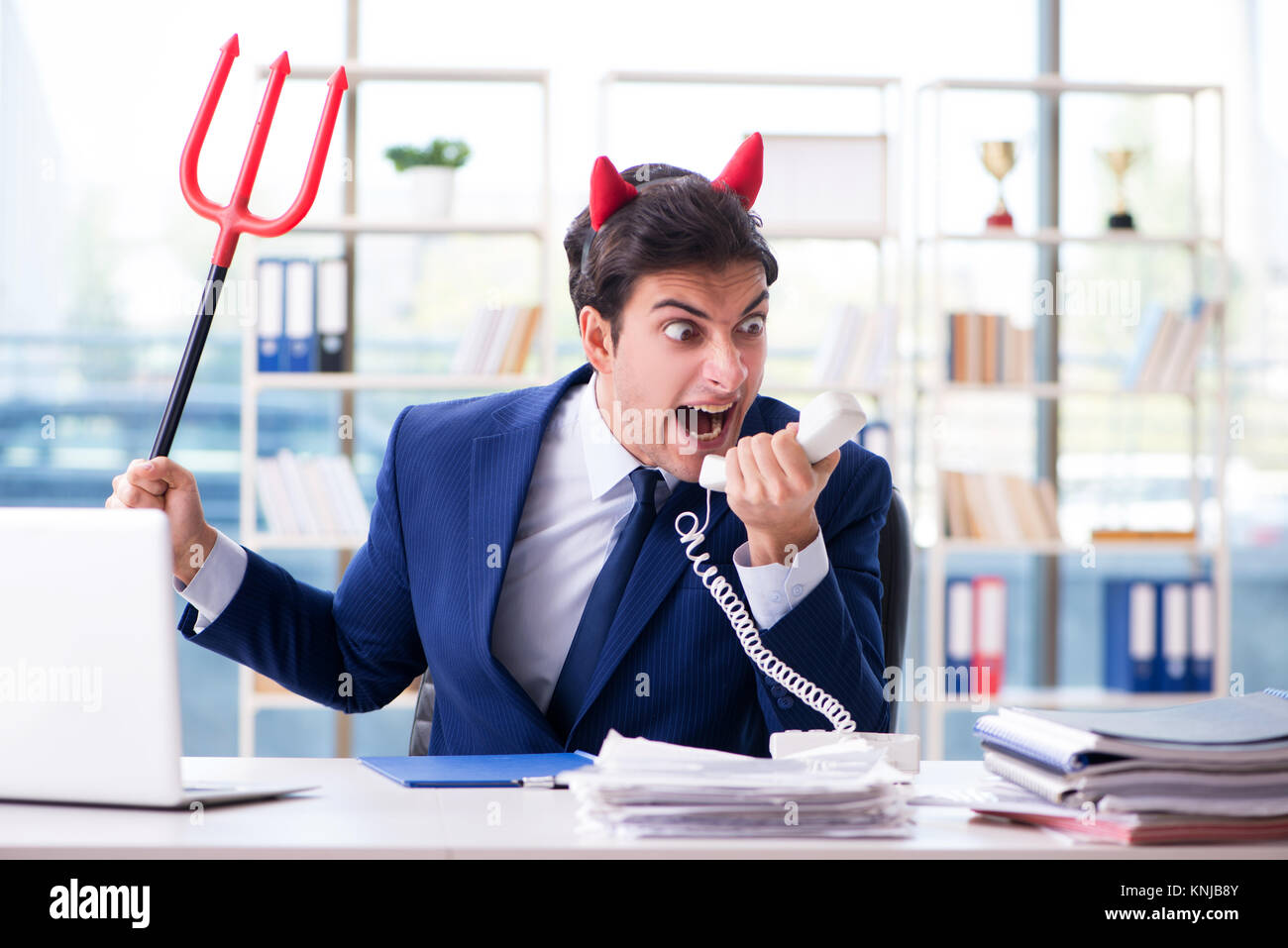 Devil angry businessman in the office Stock Photo - Alamy