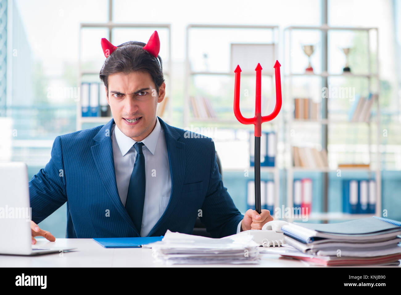 Devil angry businessman in the office Stock Photo - Alamy