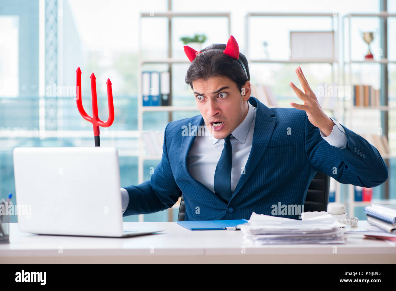 Devil angry businessman in the office Stock Photo - Alamy