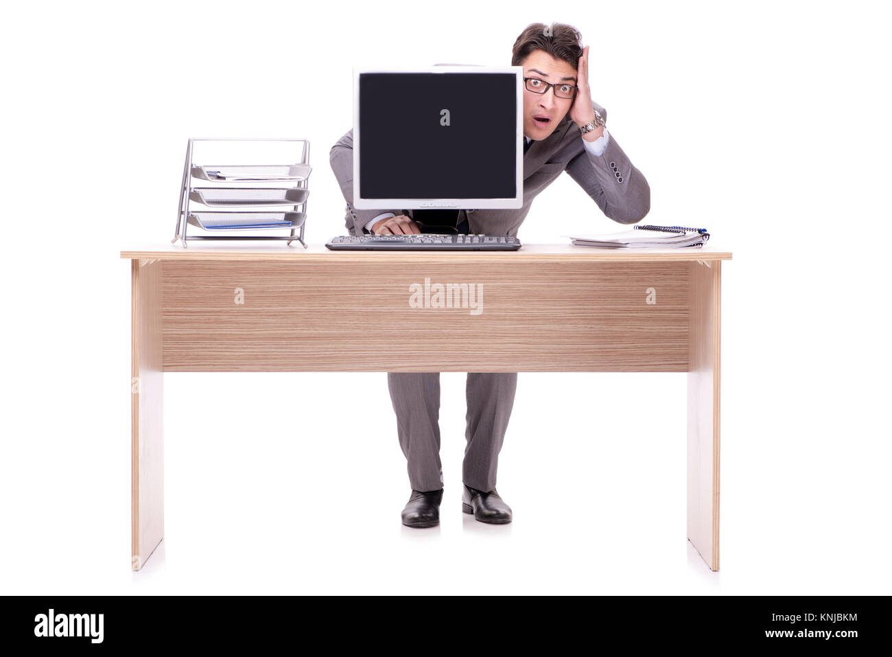 Businessman hiding in the office isolated on white Stock Photo - Alamy