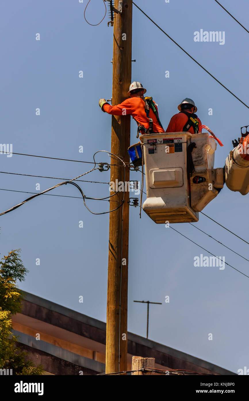Electricians in cradle repair hi-res stock photography and images - Alamy