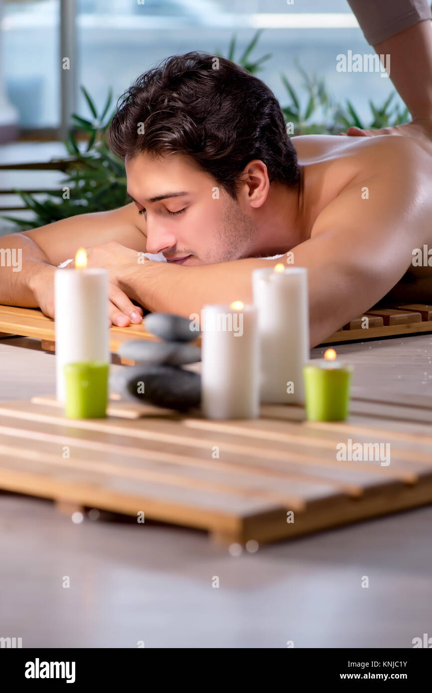Young handsome man during spa procedure Stock Photo - Alamy