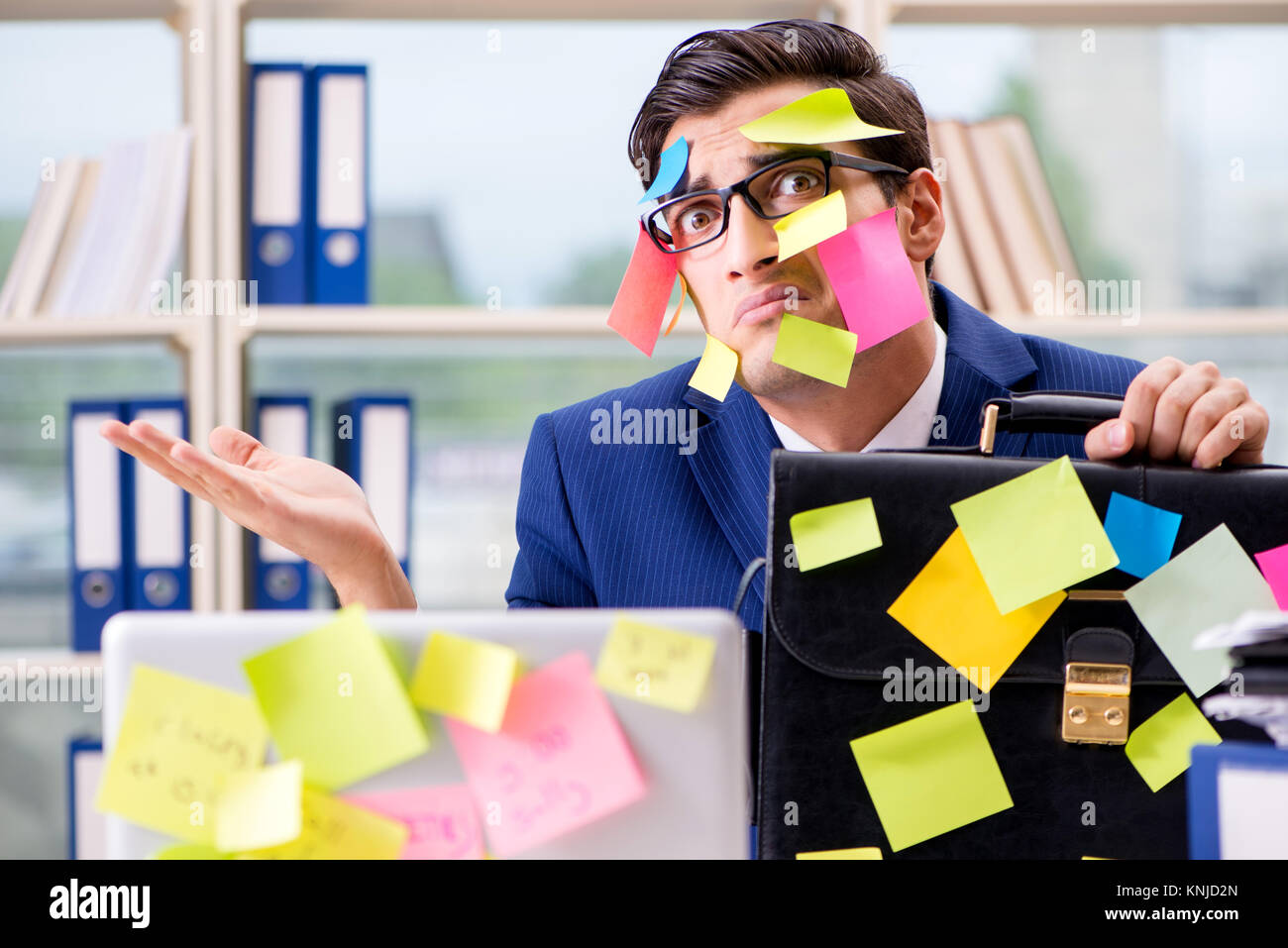 Businessman with reminder notes in multitasking concept Stock Photo - Alamy
