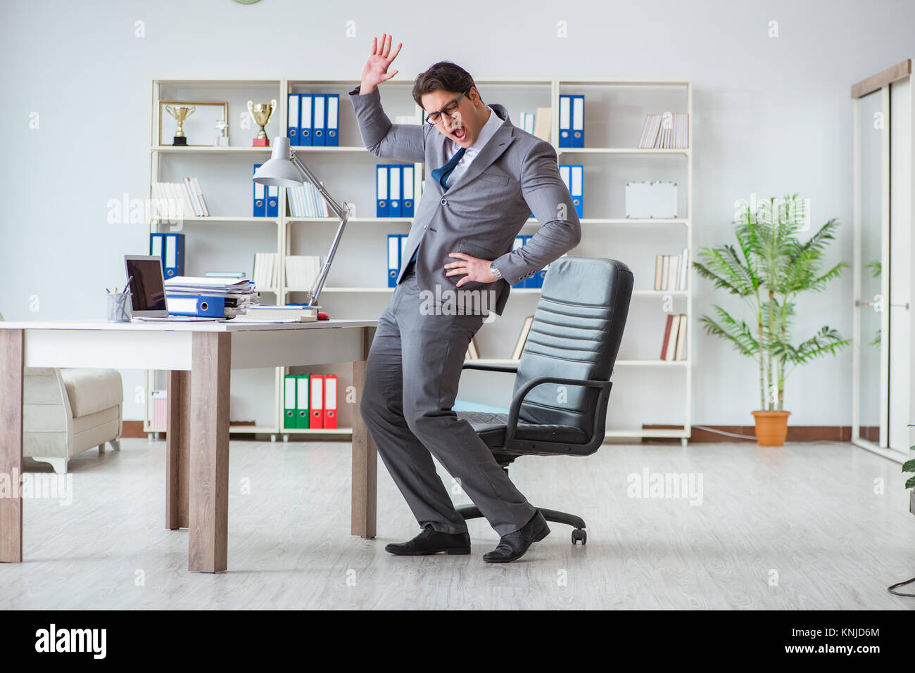 Businessman having fun taking a break in the office at work Stock Photo ...