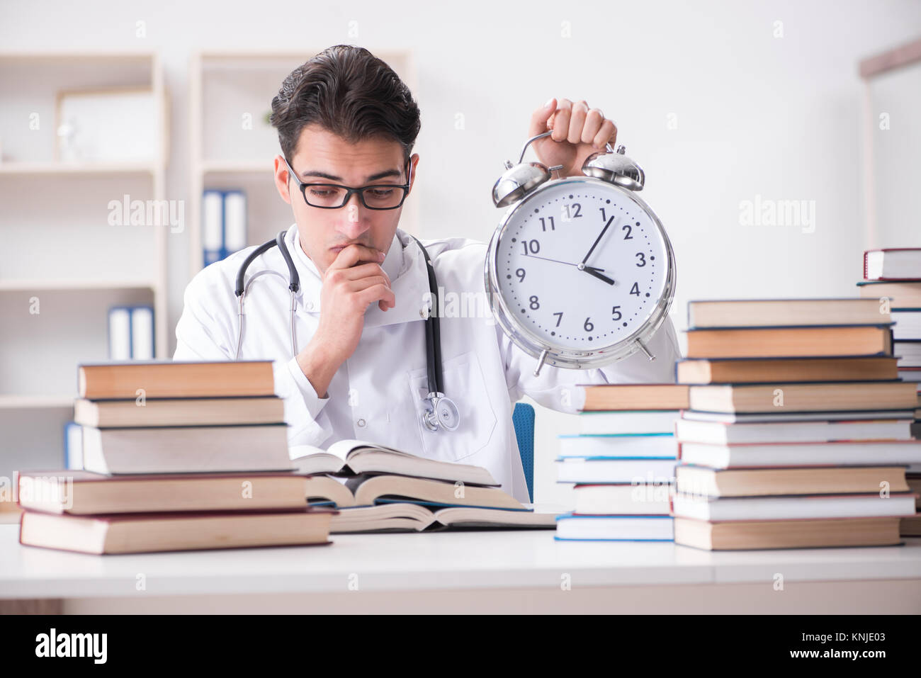 Medical student running out of time for exams Stock Photo - Alamy