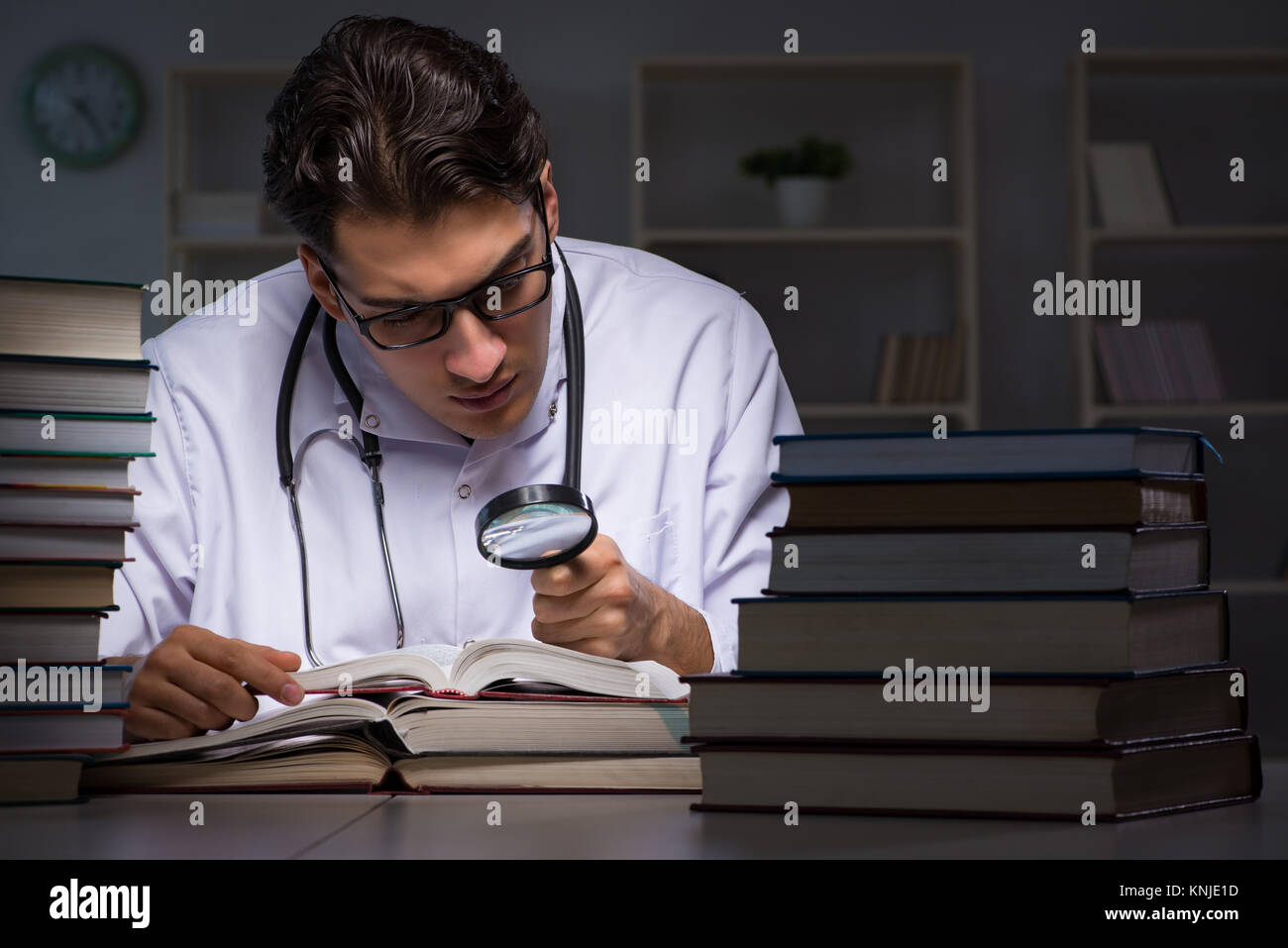 Medical student preparing for university exams at night Stock Photo - Alamy