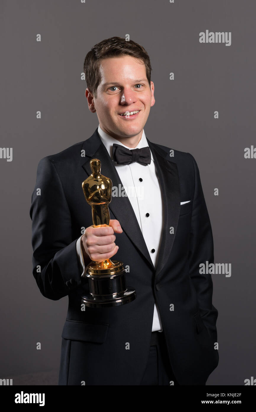 HOLLYWOOD, CA - FEBRUARY 22: Graham Moore poses backstage with the ...
