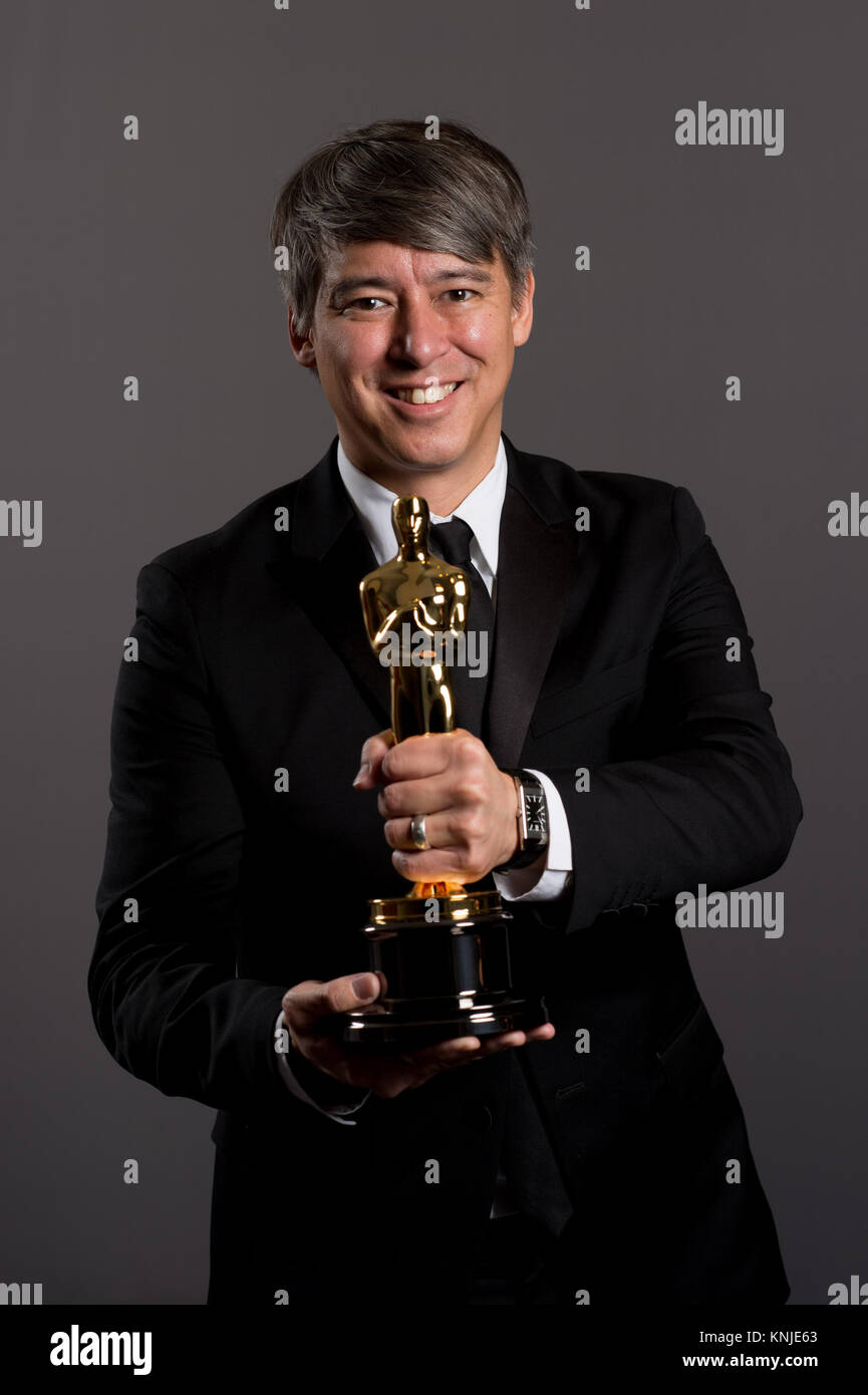 HOLLYWOOD, CA - FEBRUARY 22: Tom Cross poses backstage with the Oscar ...