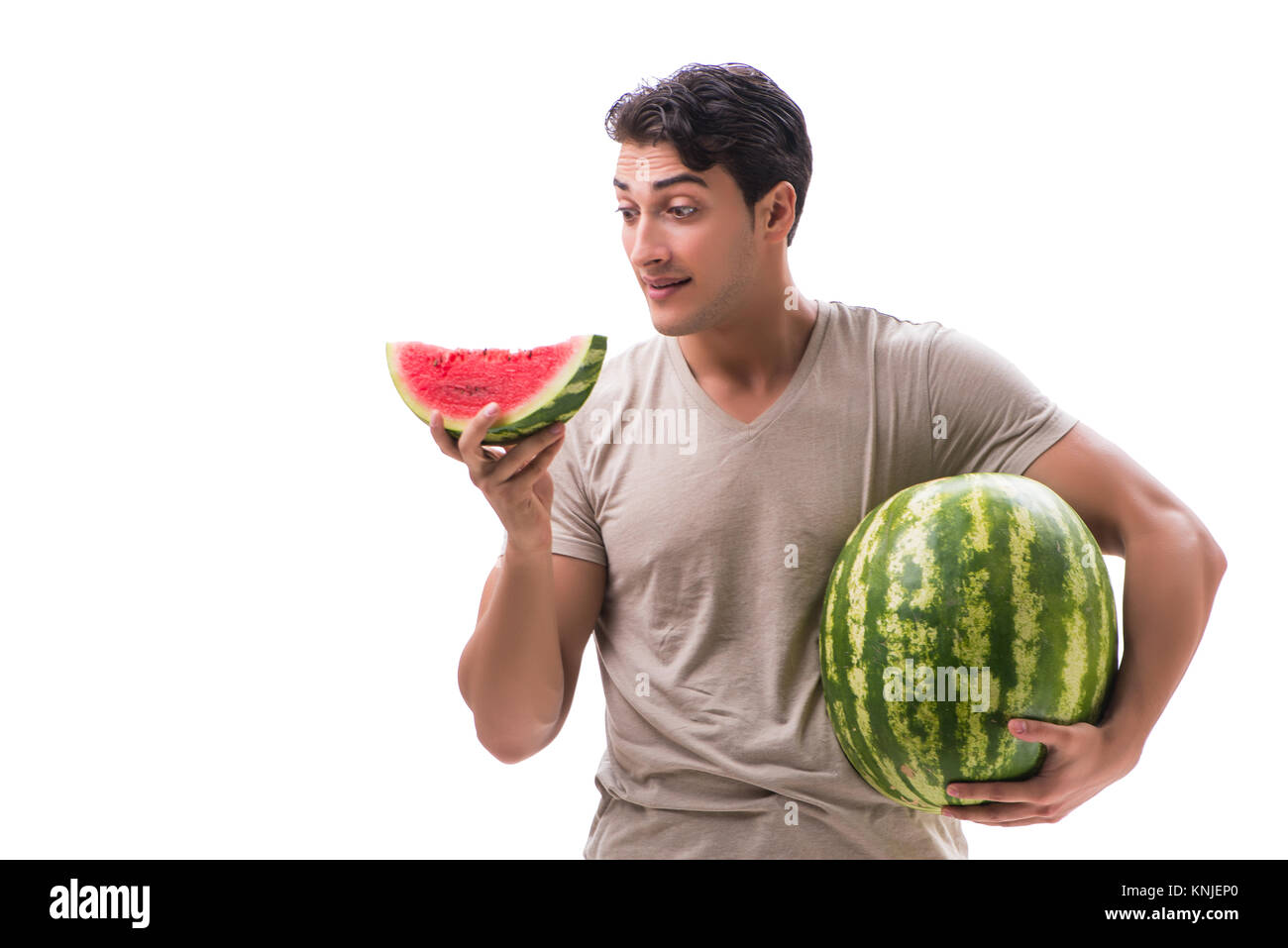 Young man with watermelon isolated on white Stock Photo - Alamy