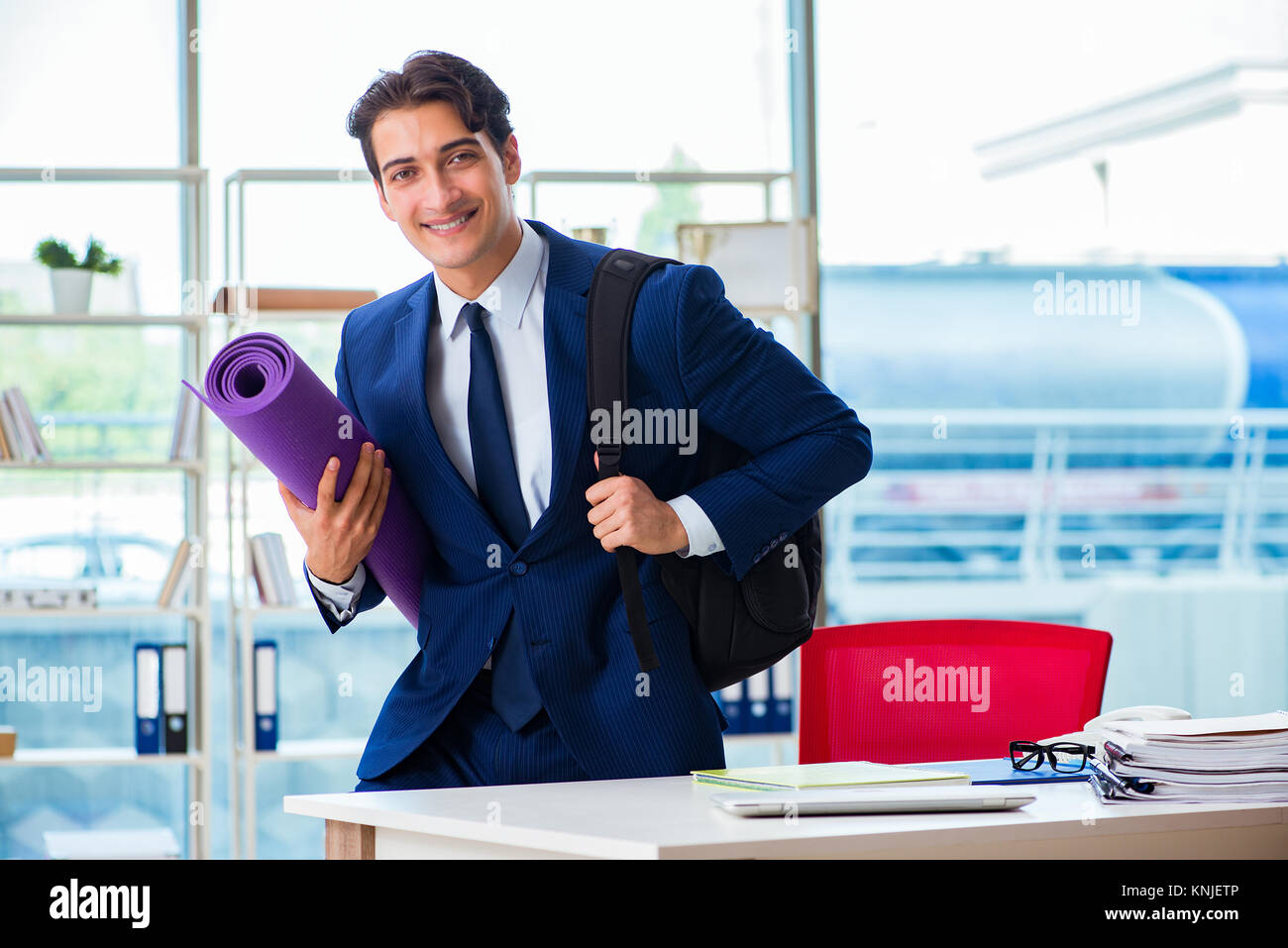 Man getting ready for sports break in the office Stock Photo - Alamy