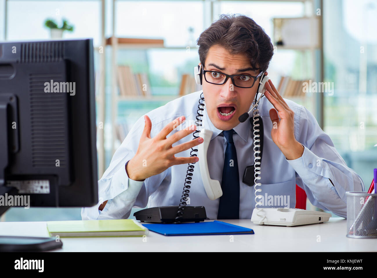 Unhappy angry call center worker frustrated with workload Stock Photo ...