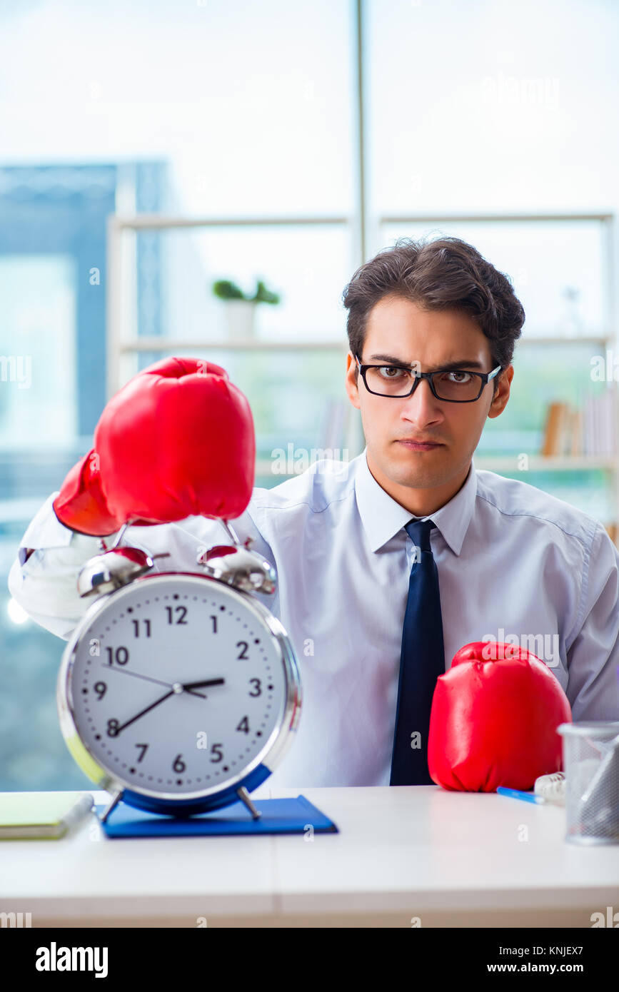 Businessman with boxing gloves in the office Stock Photo - Alamy