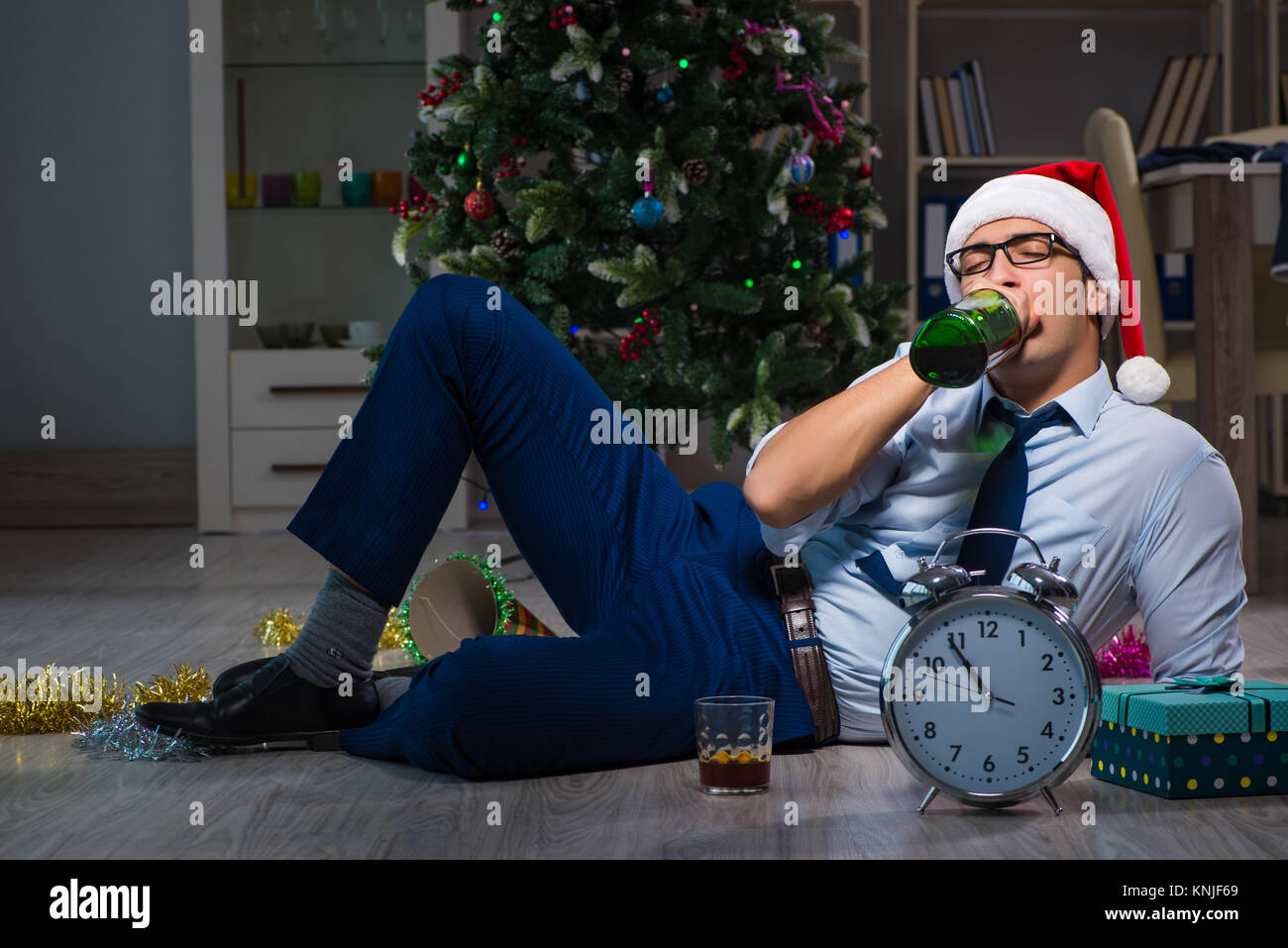 Businessman celebrating christmas at home alone Stock Photo - Alamy
