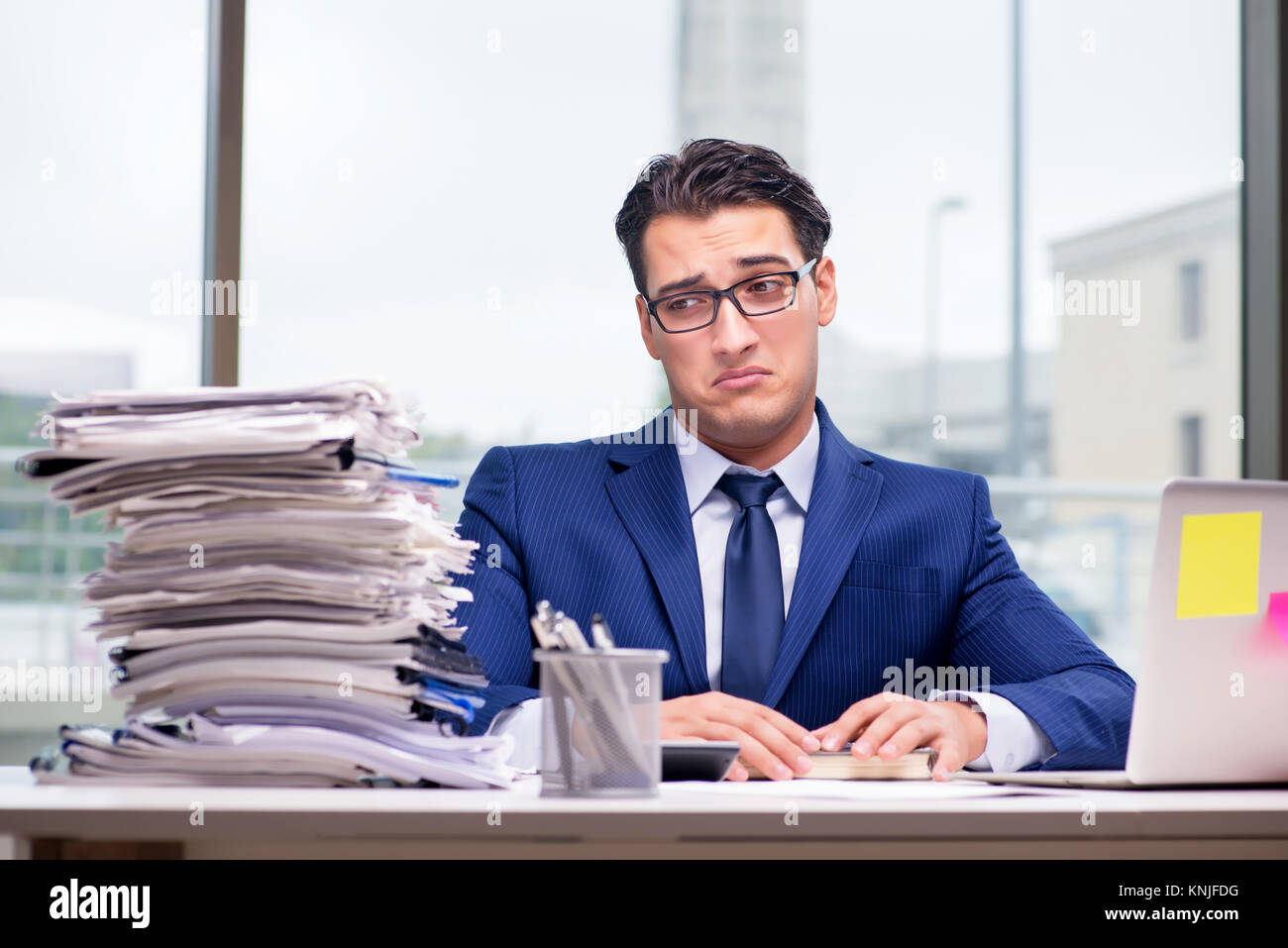 Workaholic businessman overworked with too much work in office Stock ...
