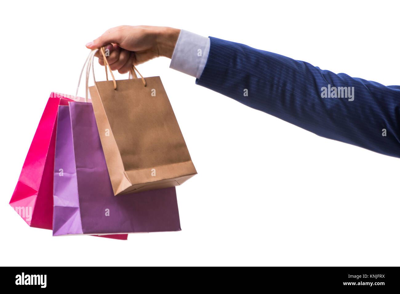 Hand holding shopping bags with christmas shopping on white background ...