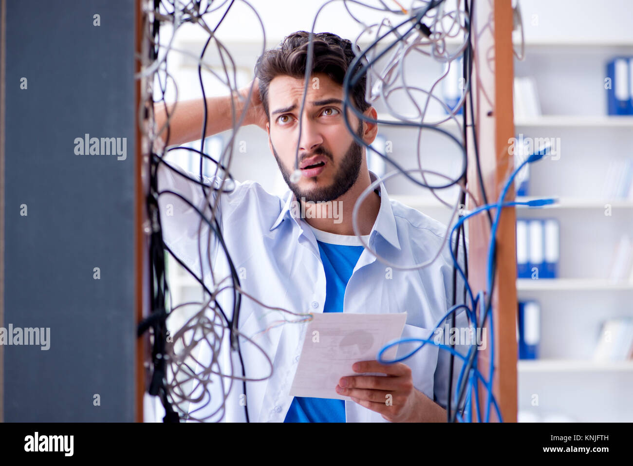 Computer repairman working on repairing network in IT workshop Stock ...