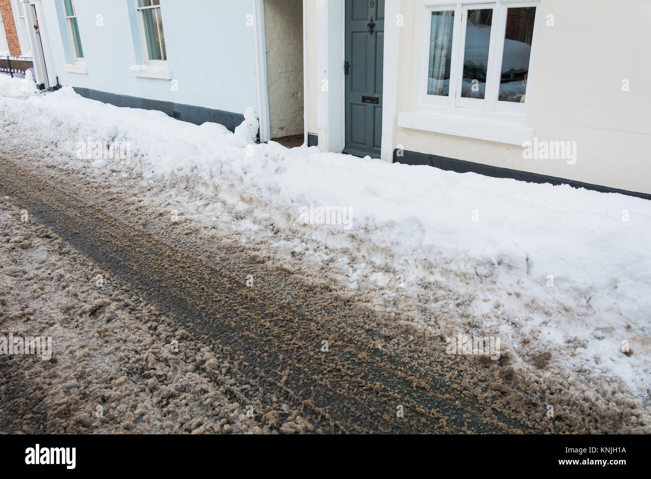 Much Wenlock, UK. 11th December, 2017. The plowed snow builds up on the ...