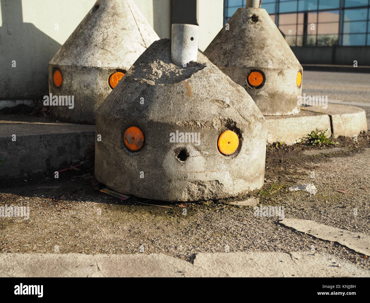 Berlin, Germany. 26th Mar, 2016. A concrete block with two reflecting ...