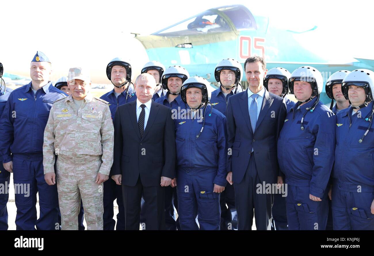 Russian President Vladimir Putin, center, poses with Russian fighter ...