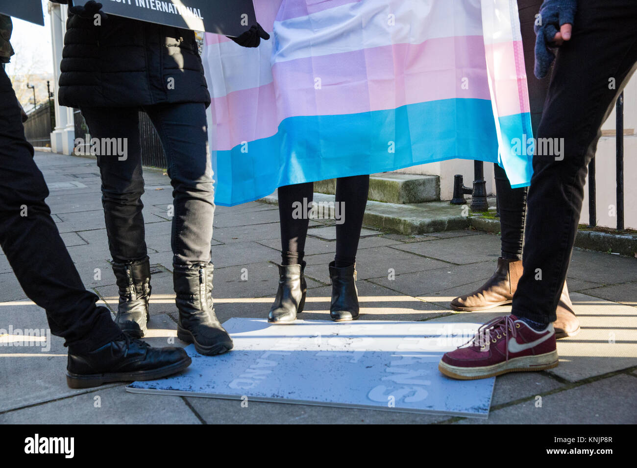 London, UK. 12th December, 2017. Amnesty International activists with a ...
