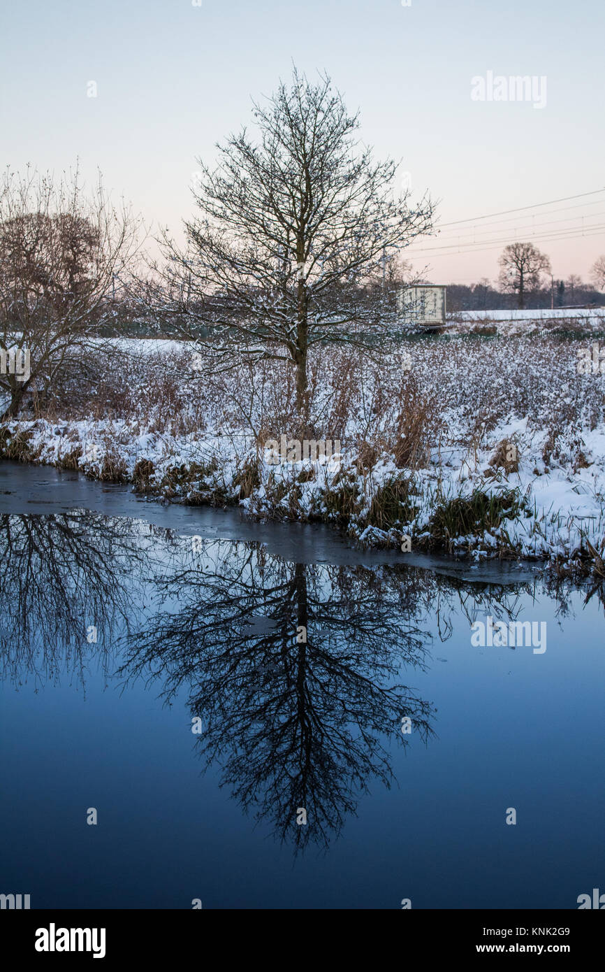 A beautiful snowy canal in the gorgeous countryside of England, UK ...