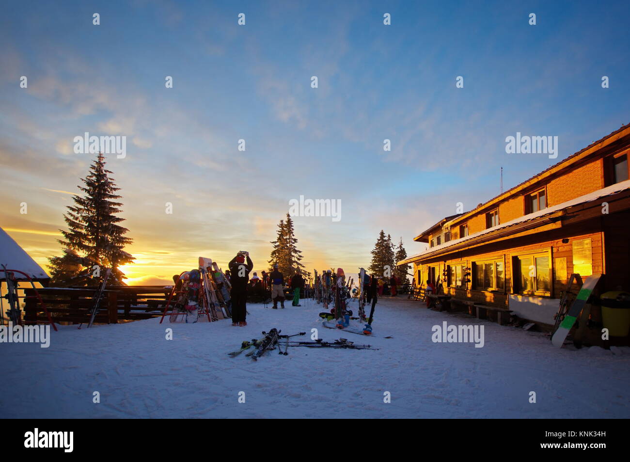 Cabana Postavaru chalet in Poiana Brasov Romanian by winter at suynset ...