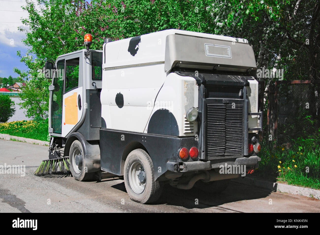 Machine sweeper - cleaner cleans the roadway. Machine brushes sweeping ...