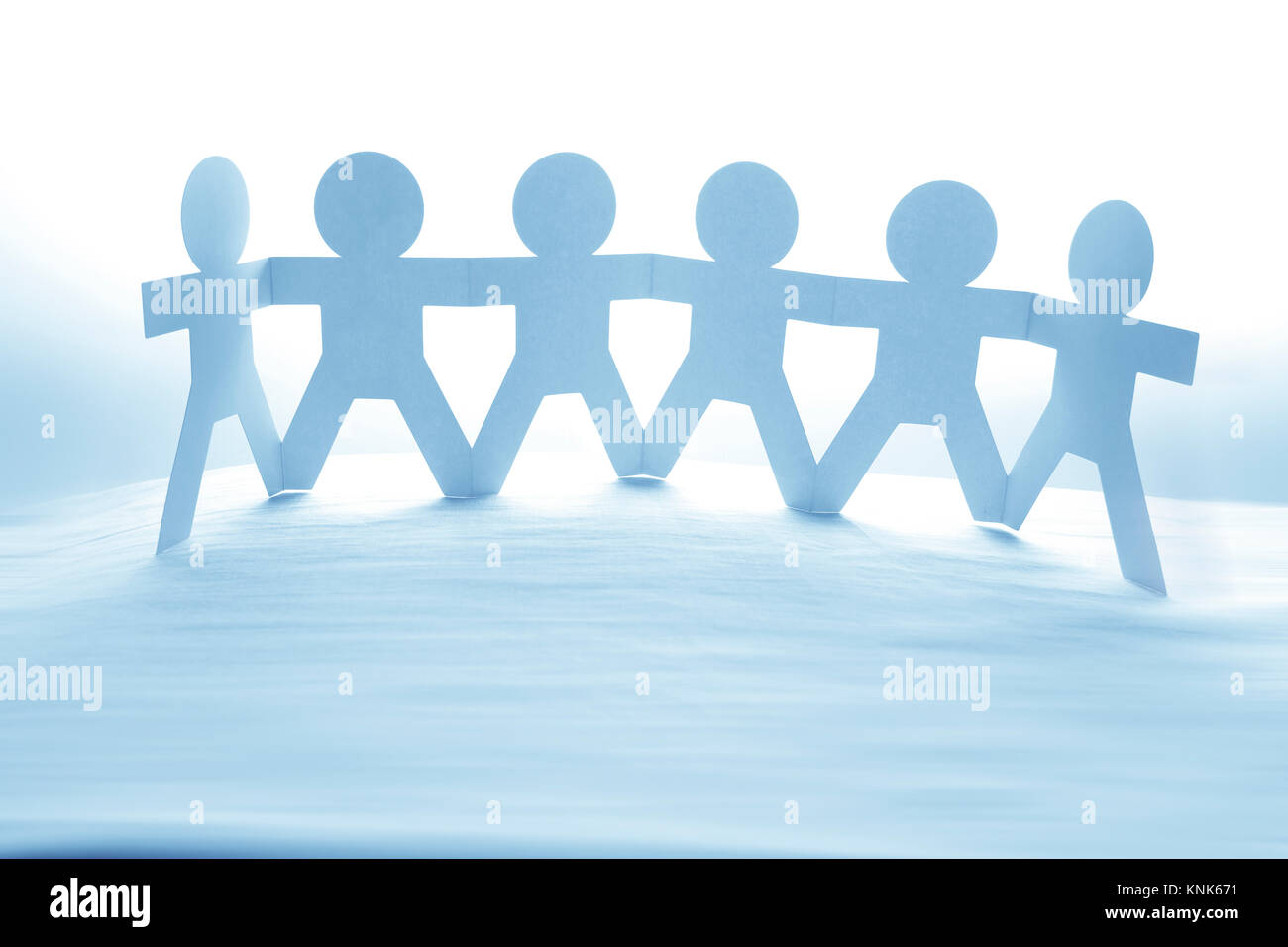 Team of paper chain people Stock Photo - Alamy